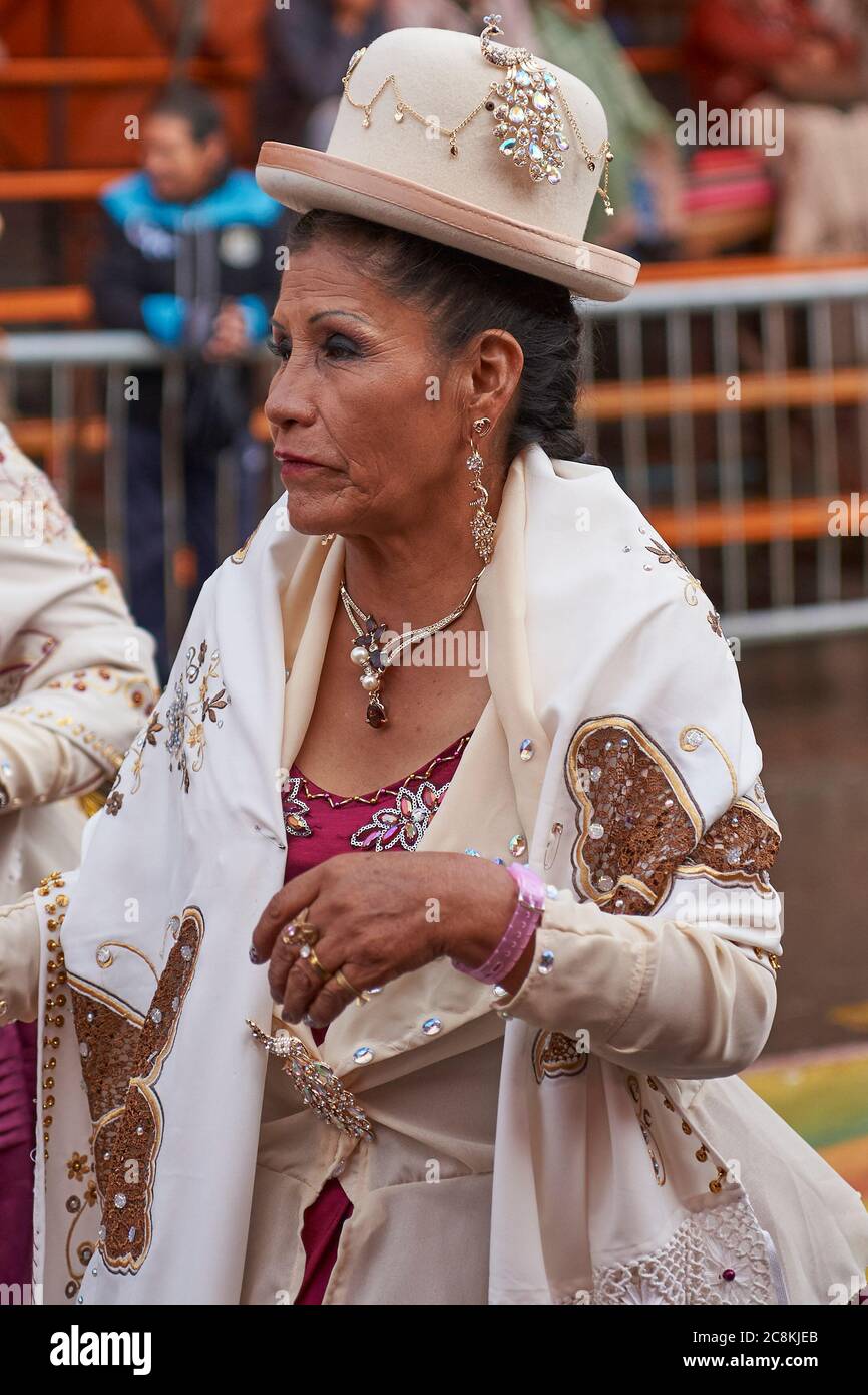 Morenada dancers in ornate costumes parade through the mining city of ...