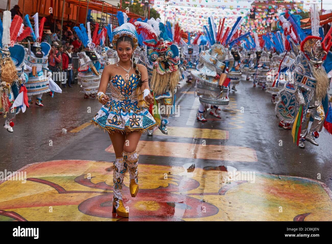 Morenada dancers in ornate costumes parade through the mining city of ...