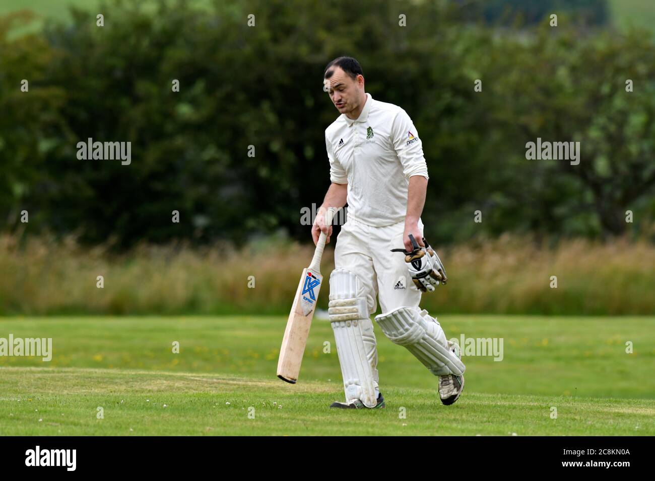 A Birch Vale and Thornsett batsman returns to the pavilion after being ...