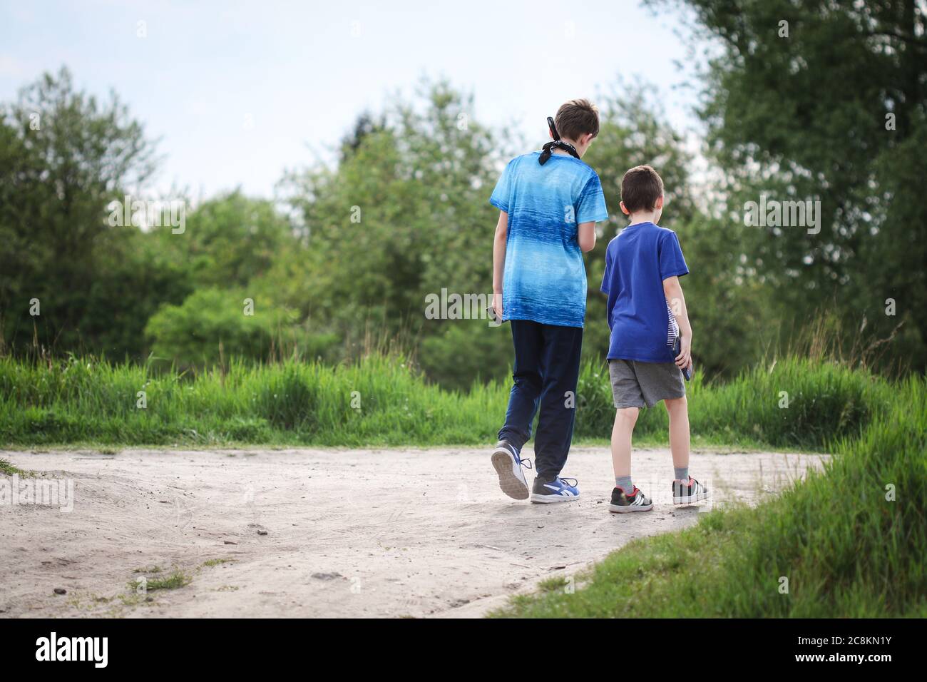 Walking together on a road hi-res stock photography and images - Alamy