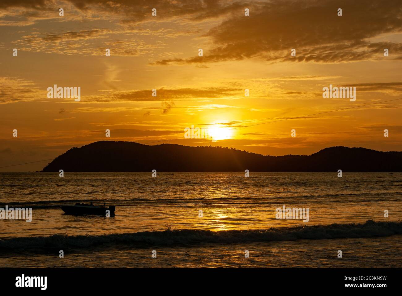 Sunset over the Island Stock Photo - Alamy