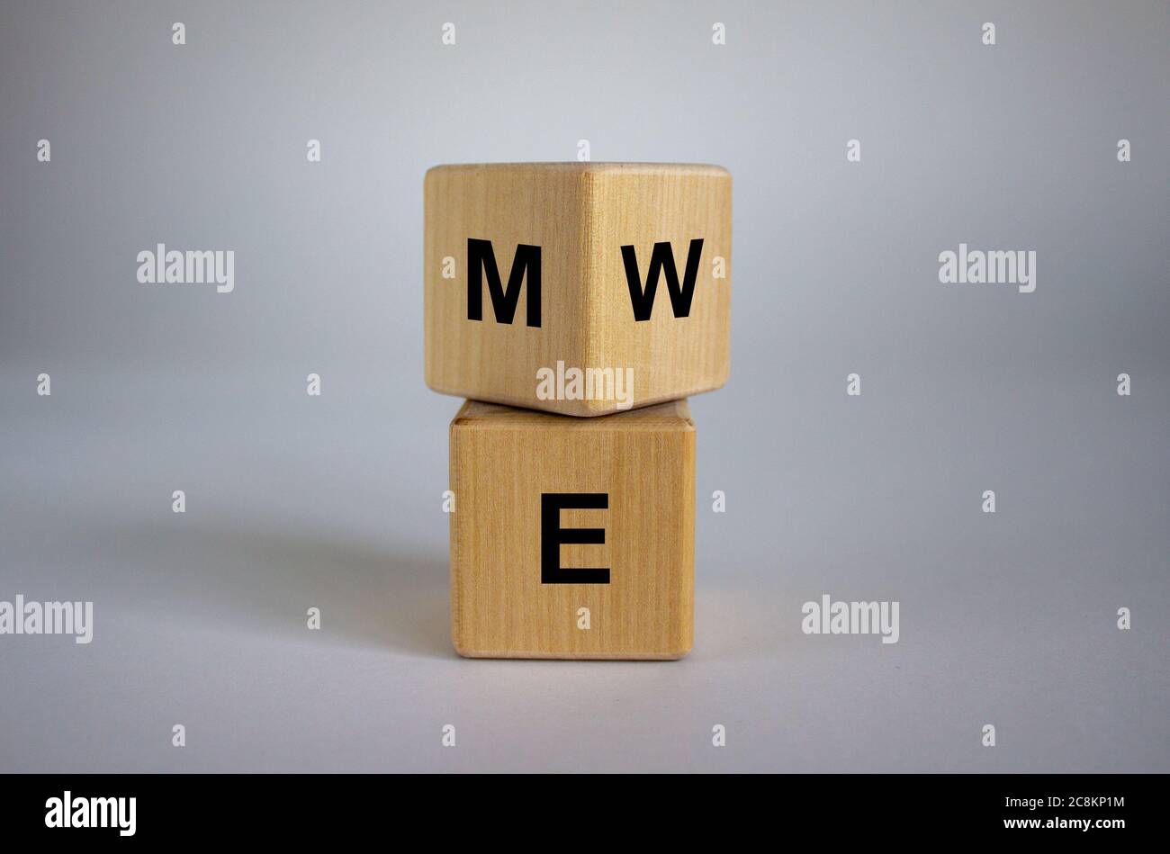 Expanded wood cube with me or we words on beautiful white background ...
