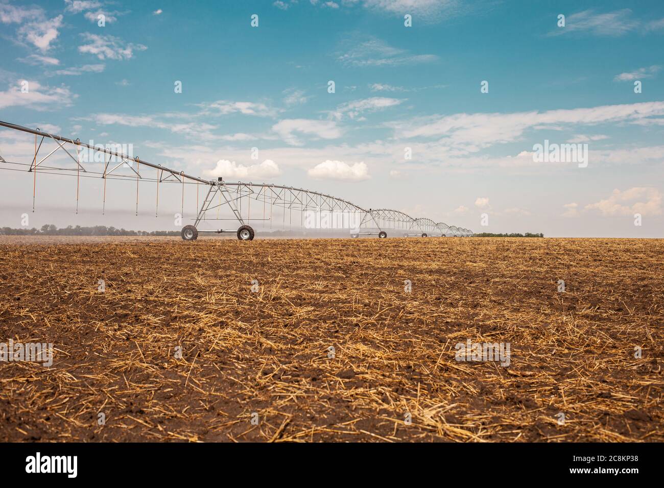 Moved irrigation system on a farmer's field. Field irrigation with a ...