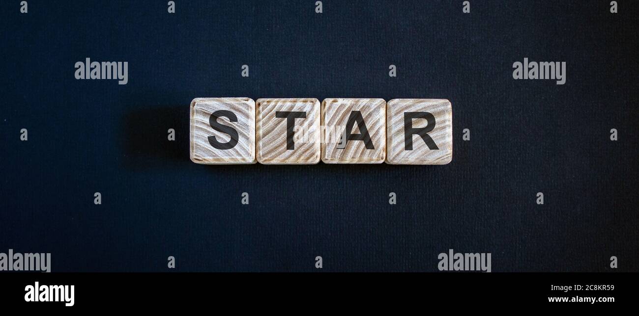 Star sign over dark blue background Stock Photo - Alamy