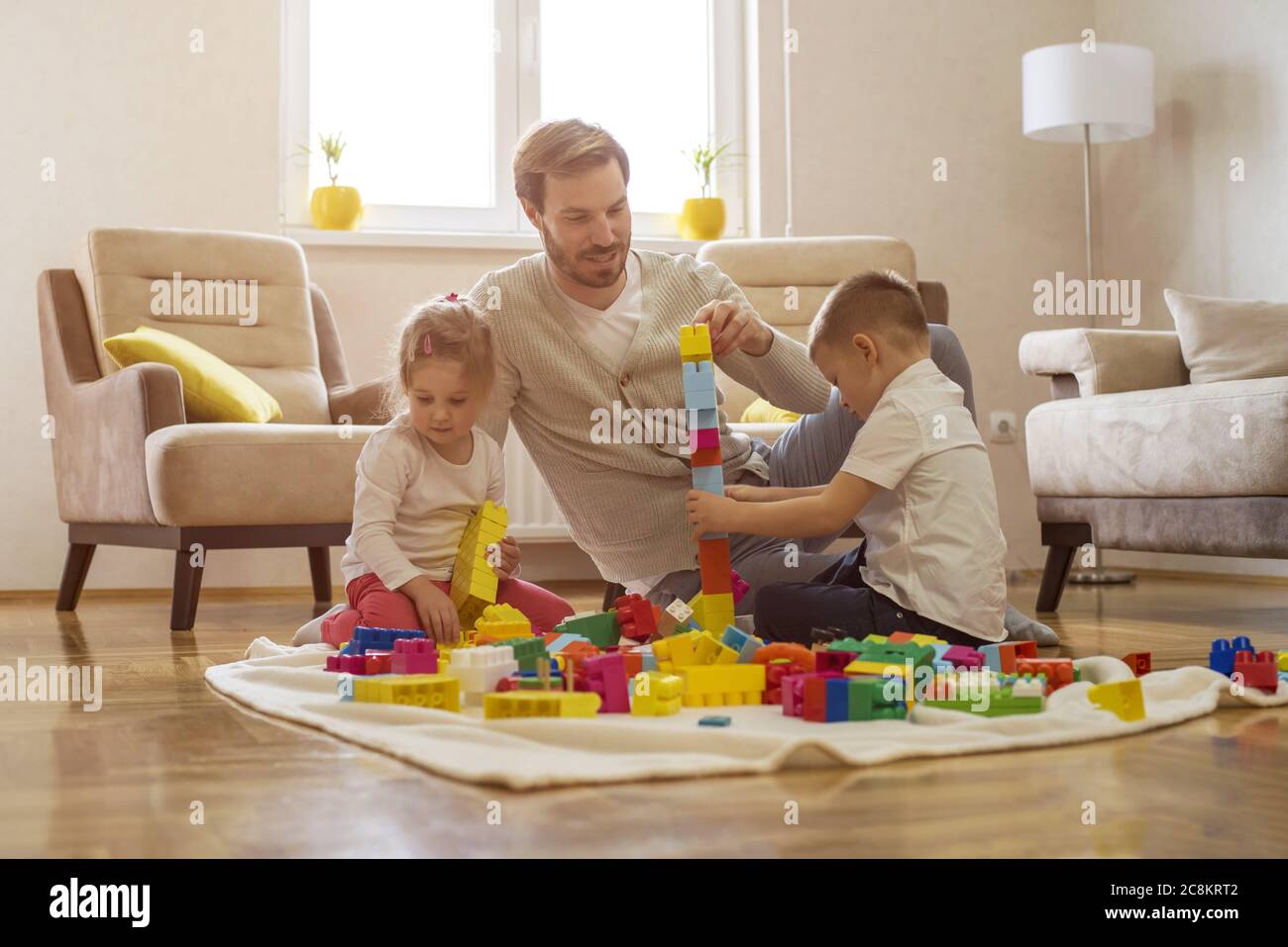 Father children playing blocks hi-res stock photography and images - Alamy