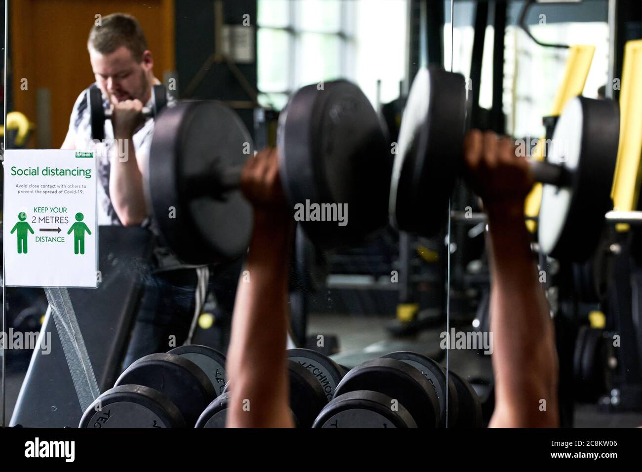 Gym members exercise at Nuffield Health Sunbury gym as indoor gyms ...