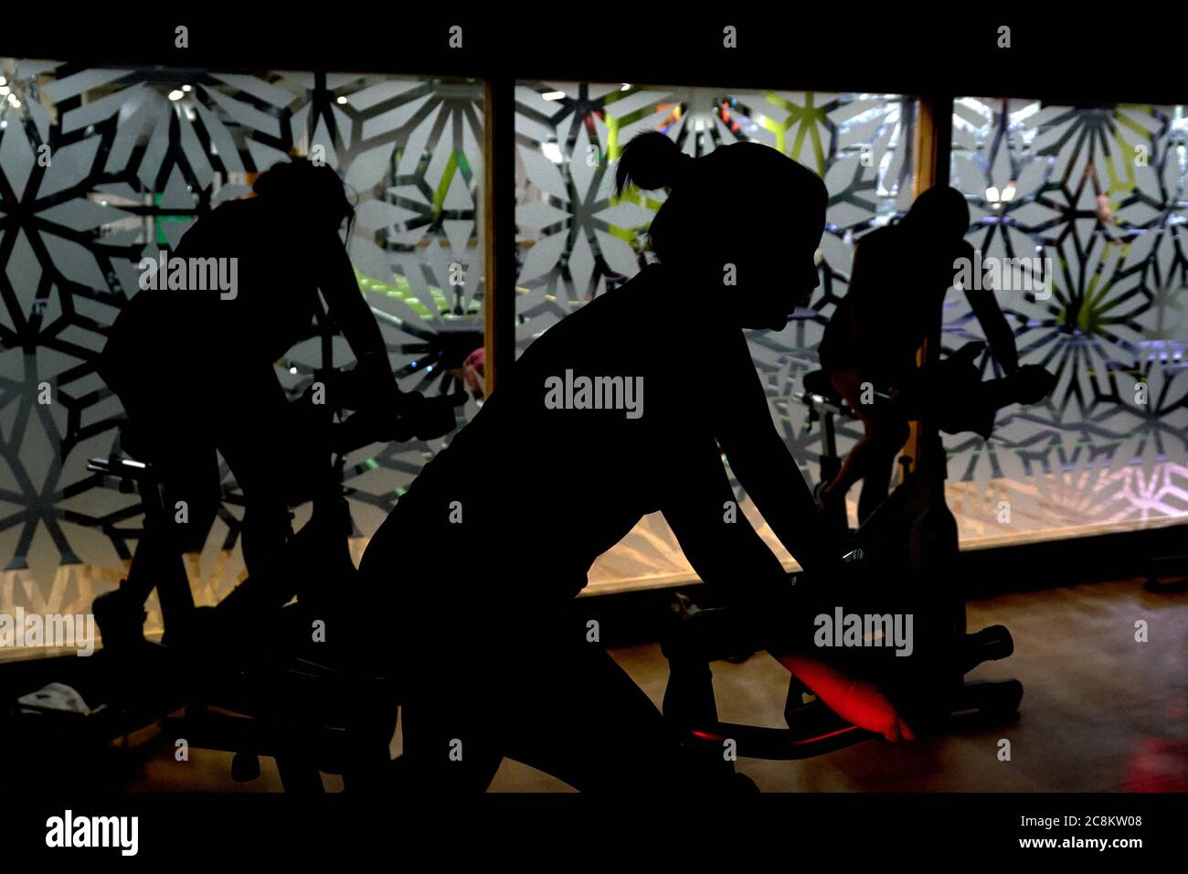 Gym members exercise at Nuffield Health Sunbury gym as indoor gyms ...