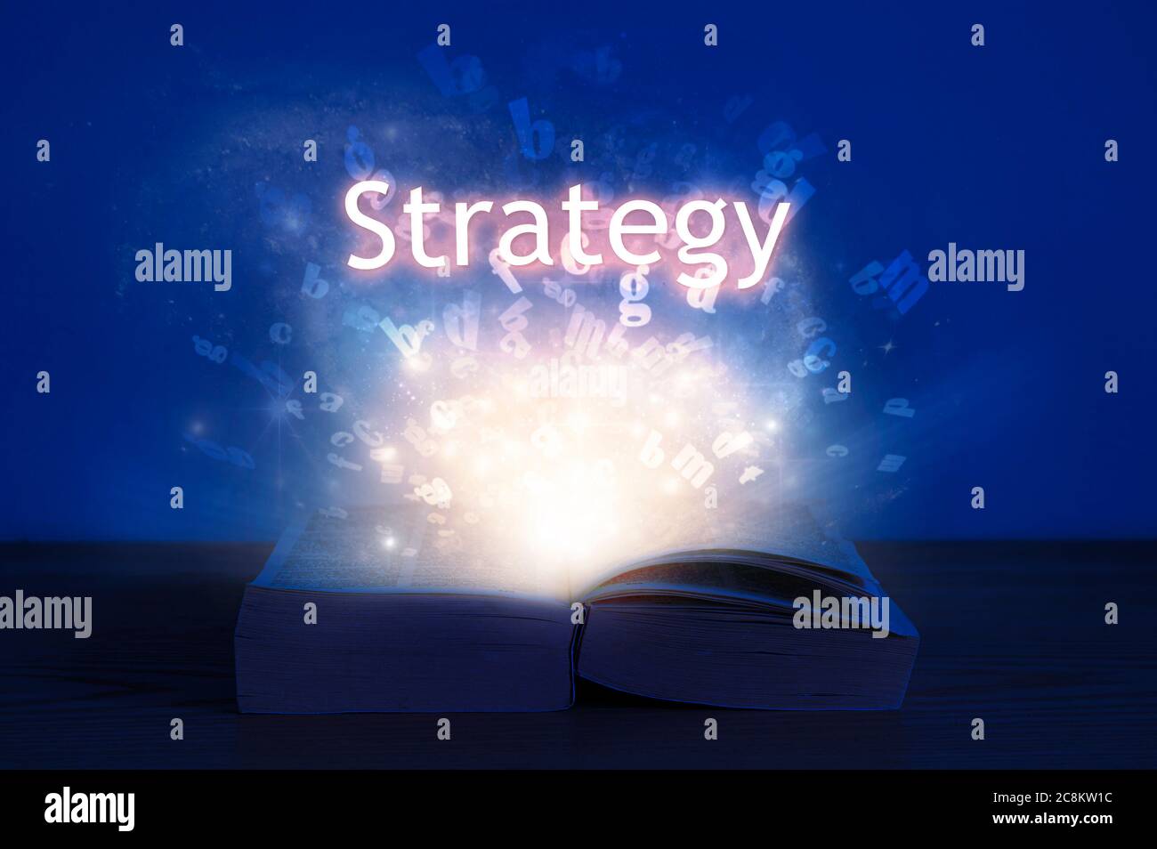 Open book with strategy inscription. Light coming from open book with ...