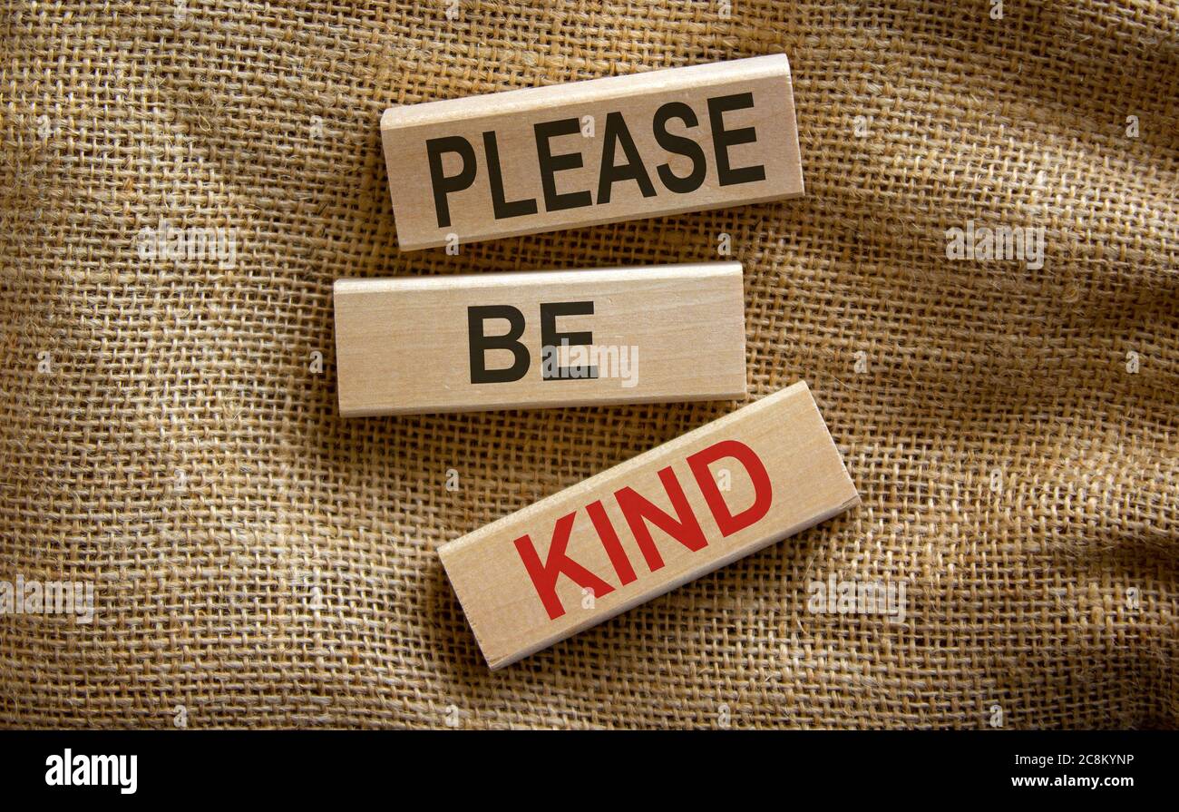 Wooden blocks form the text 'please be kind' on beautiful canvas ...