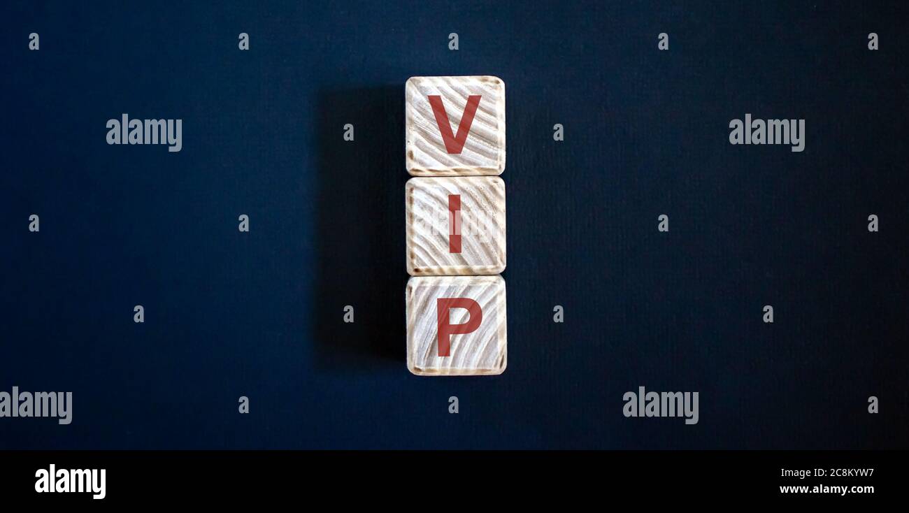 VIP sign over dark beautiful blue background Stock Photo - Alamy