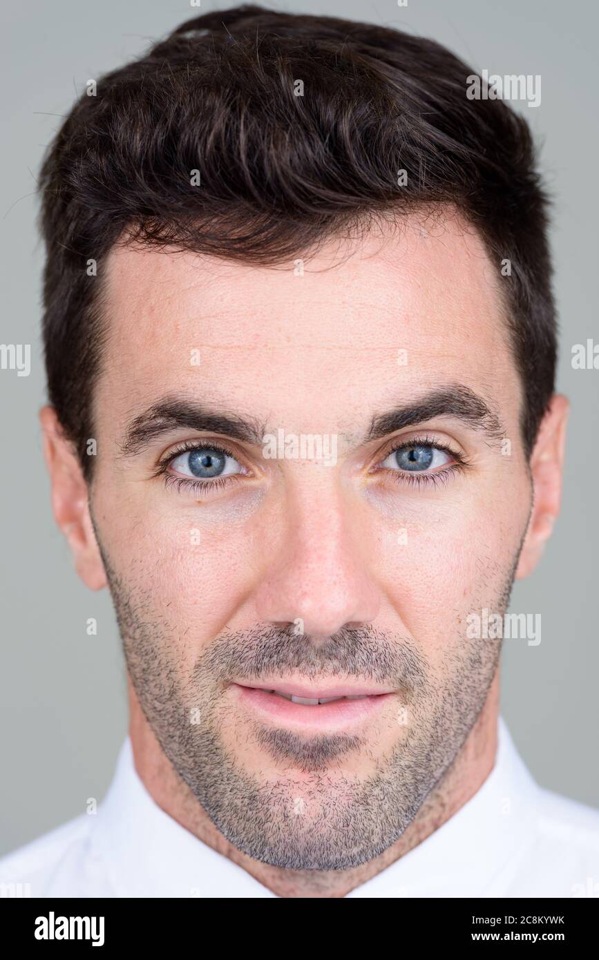 Face of handsome Hispanic businessman with beard stubble Stock Photo ...