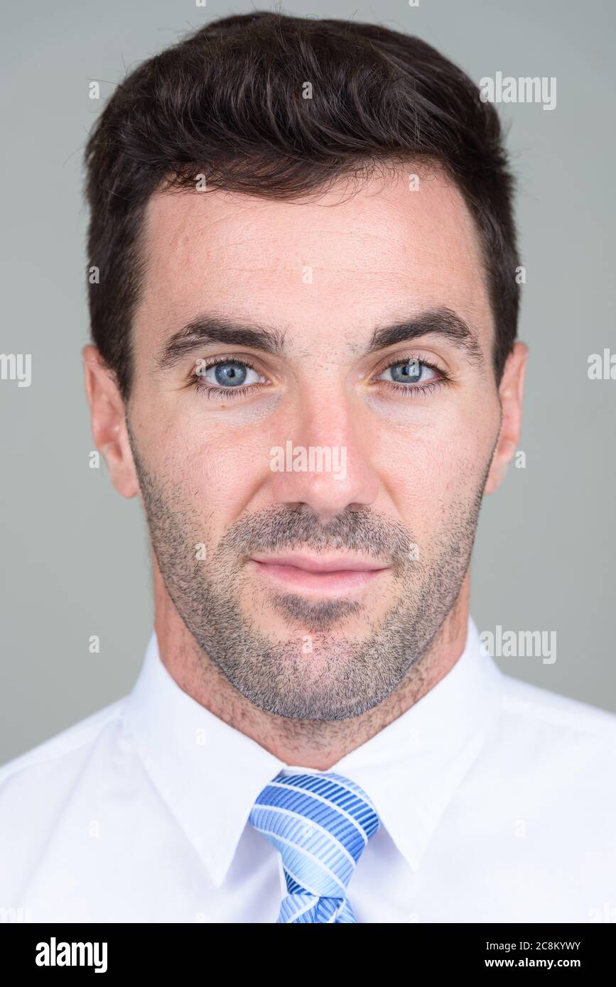 Face of handsome Hispanic businessman with beard stubble Stock Photo ...