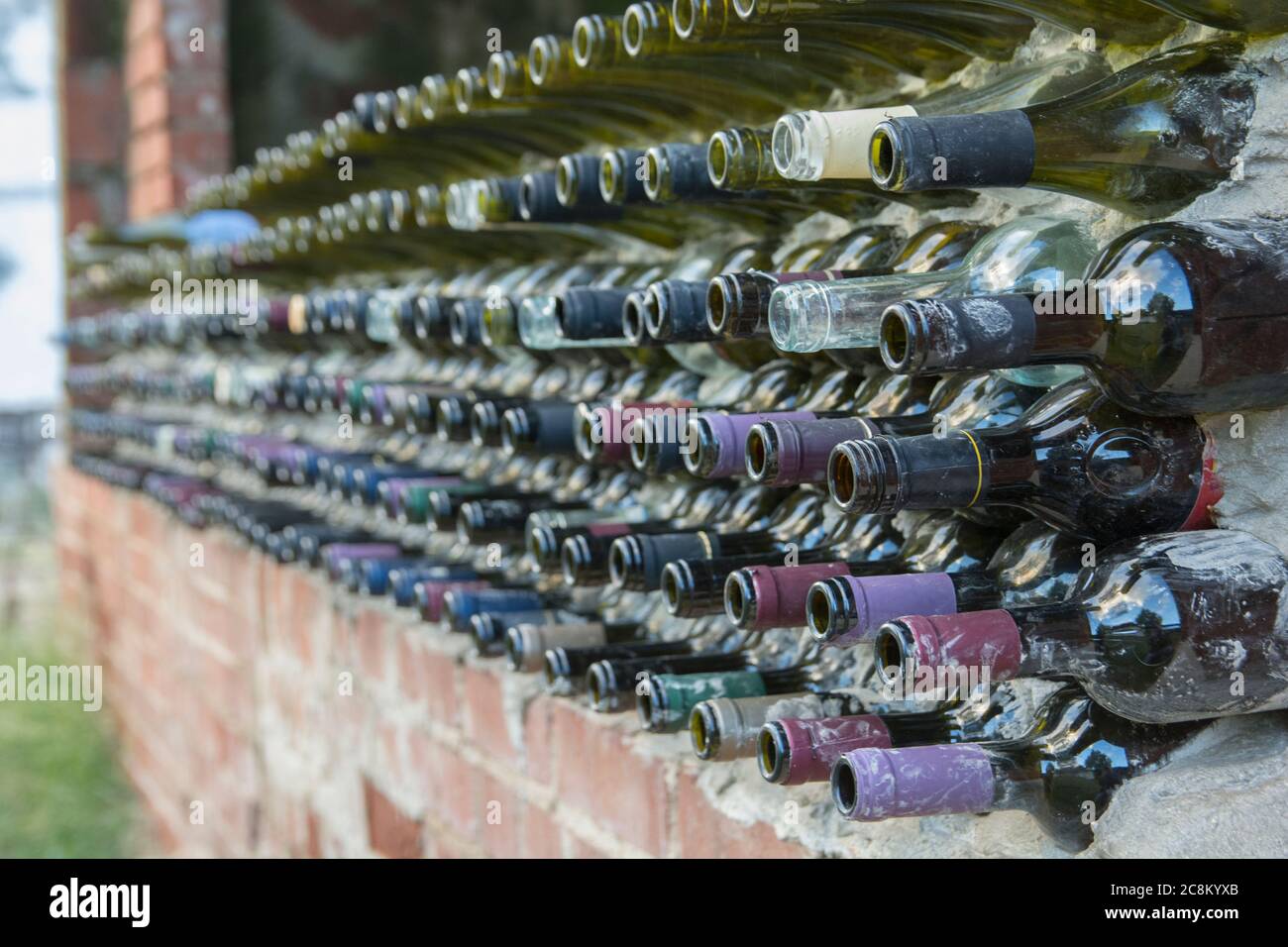 Glass bottles wall construction hi-res stock photography and images - Alamy