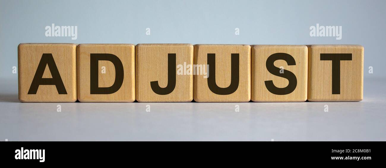 Concept word 'adjust' on cubes on a beautiful white background Stock ...