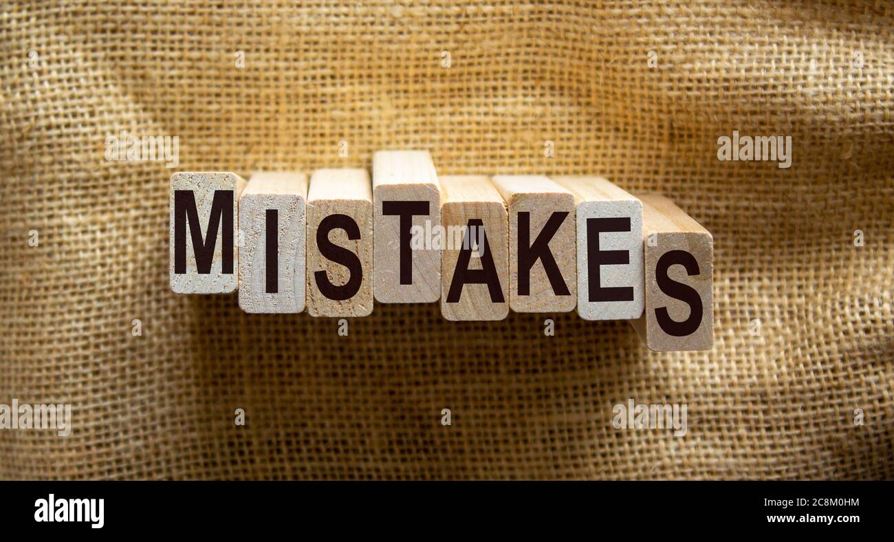 Concept word 'mistakes' on wooden blocks on a beautiful canvas ...