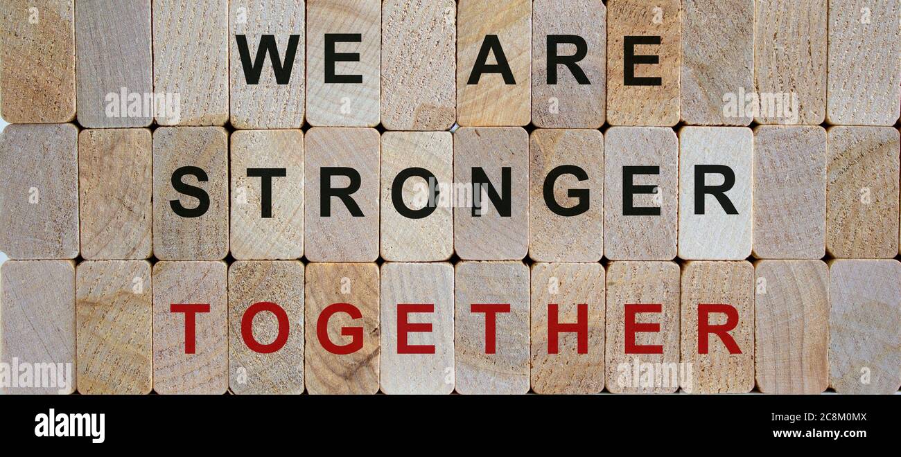 Wooden blocks form the words 'we are stronger together'. Beautiful ...