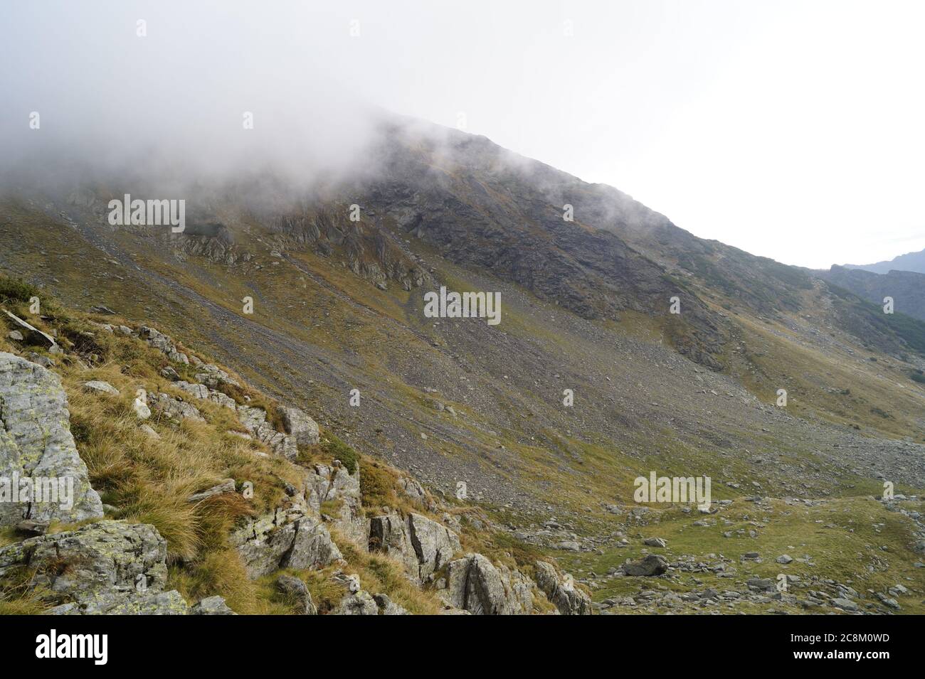 Scenic mountain view with misty weather Stock Photo - Alamy