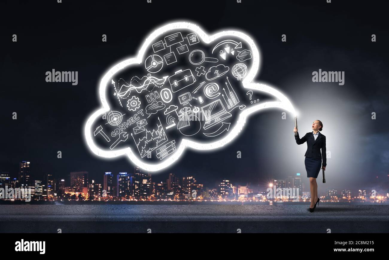 Woman throwing light on her ideas Stock Photo - Alamy