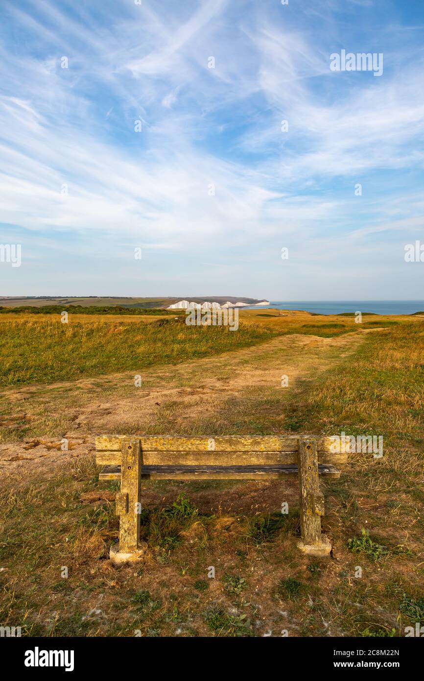 A wooden bench with a view of the Seven Sisters cliffs on the Sussex ...