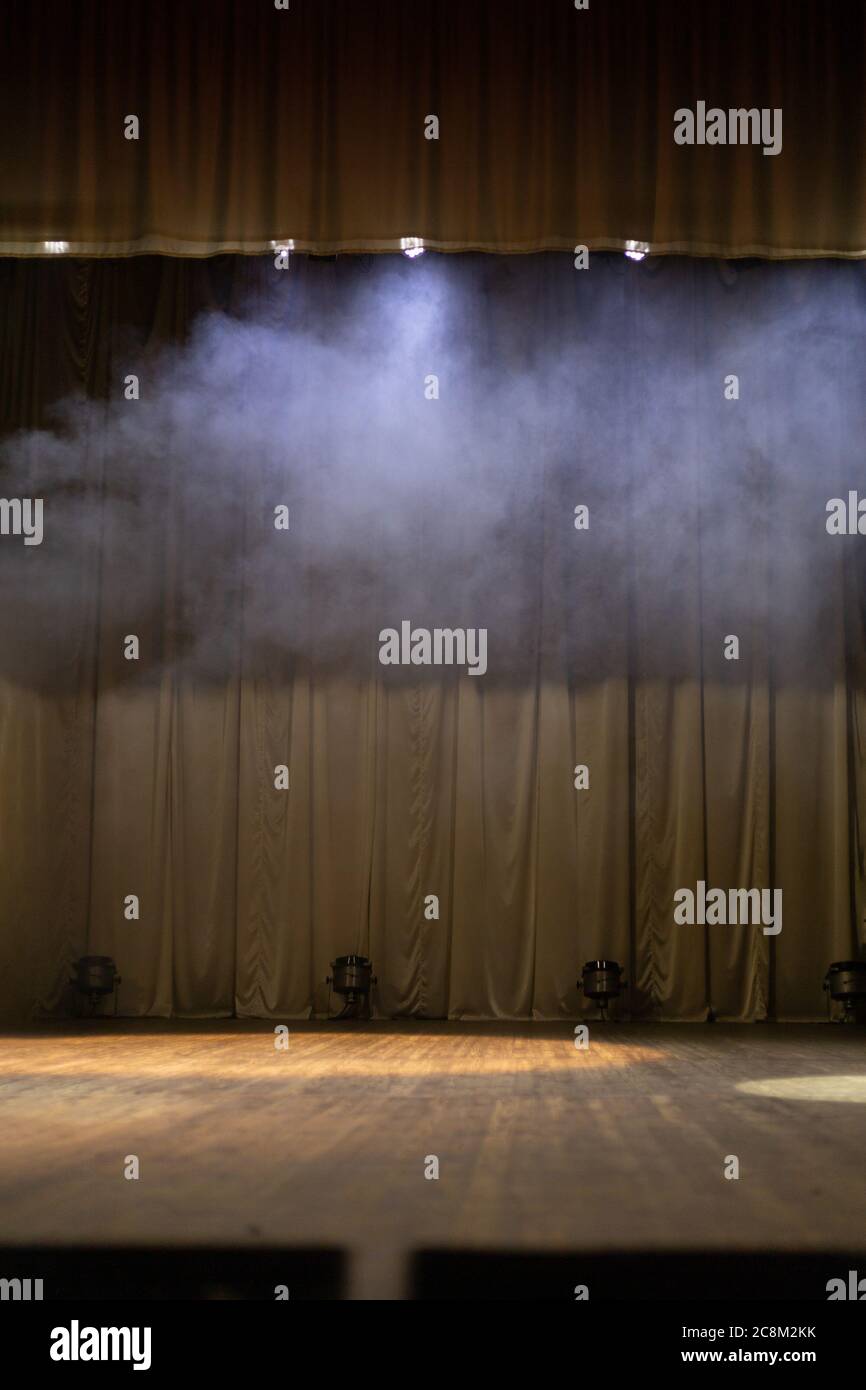 Theater stage, colored puffs of smoke in stage light Stock Photo - Alamy