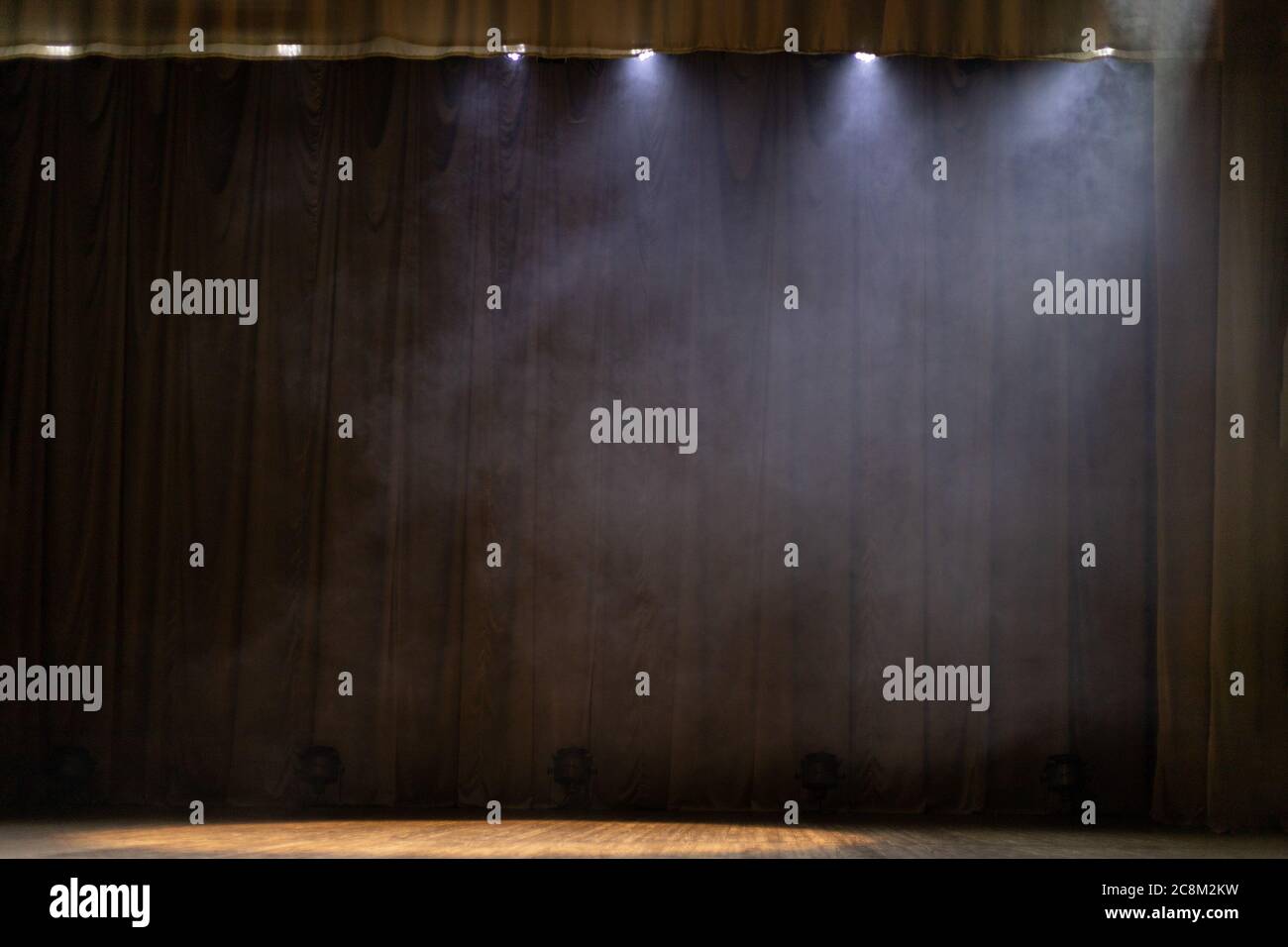 Theater stage, colored puffs of smoke in stage light Stock Photo - Alamy