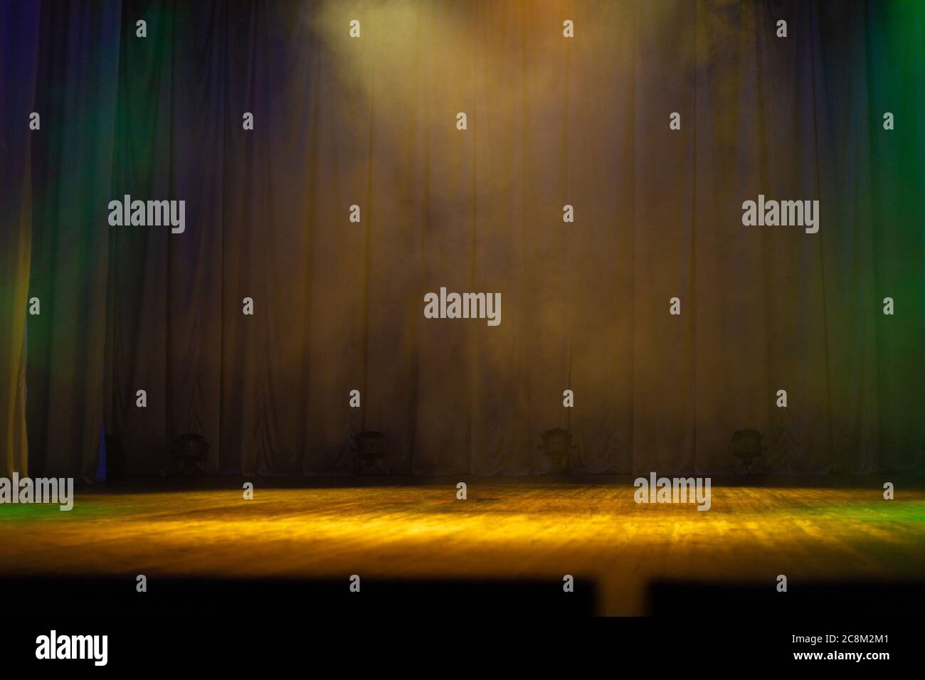 Theater stage, colored puffs of smoke in stage light Stock Photo - Alamy
