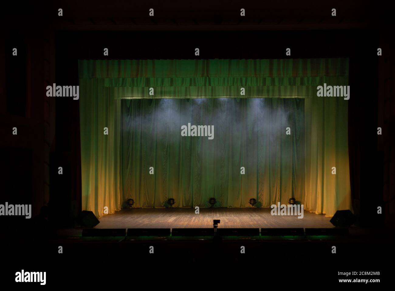 Theater stage, colored puffs of smoke in stage light Stock Photo - Alamy