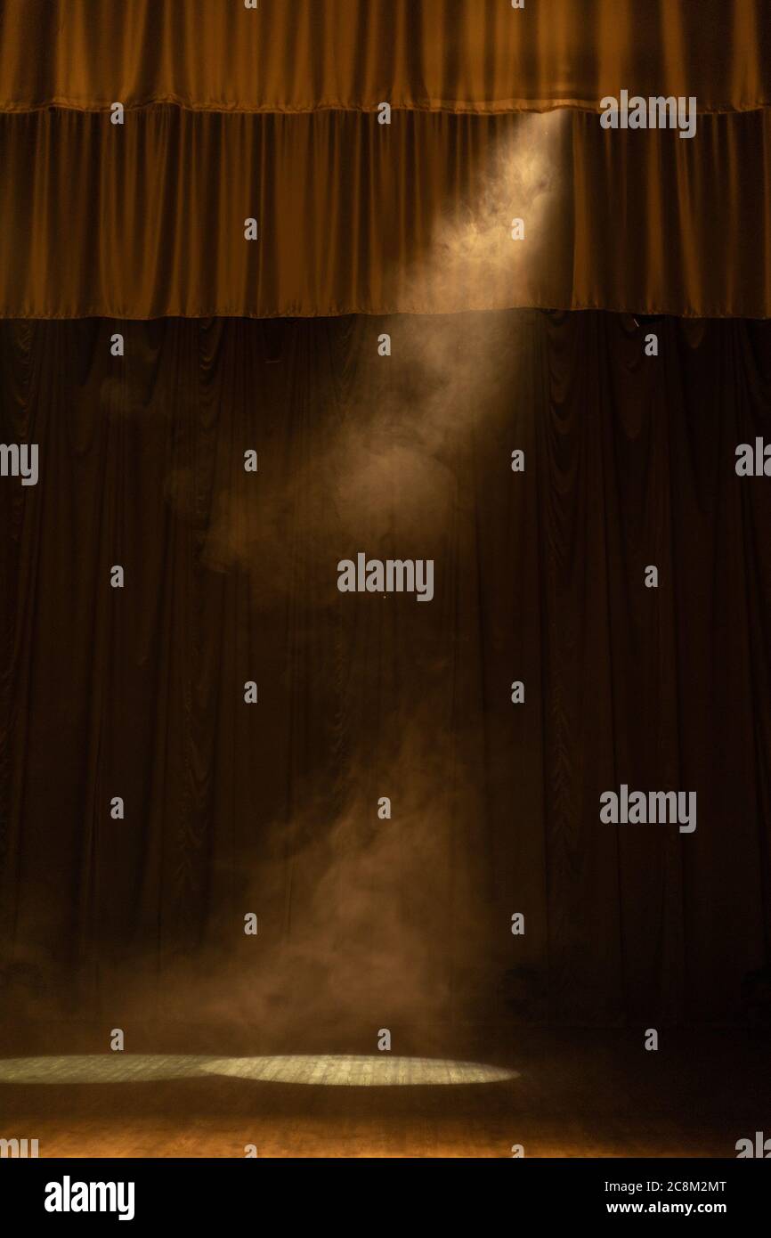 Theater stage, colored puffs of smoke in stage light Stock Photo - Alamy