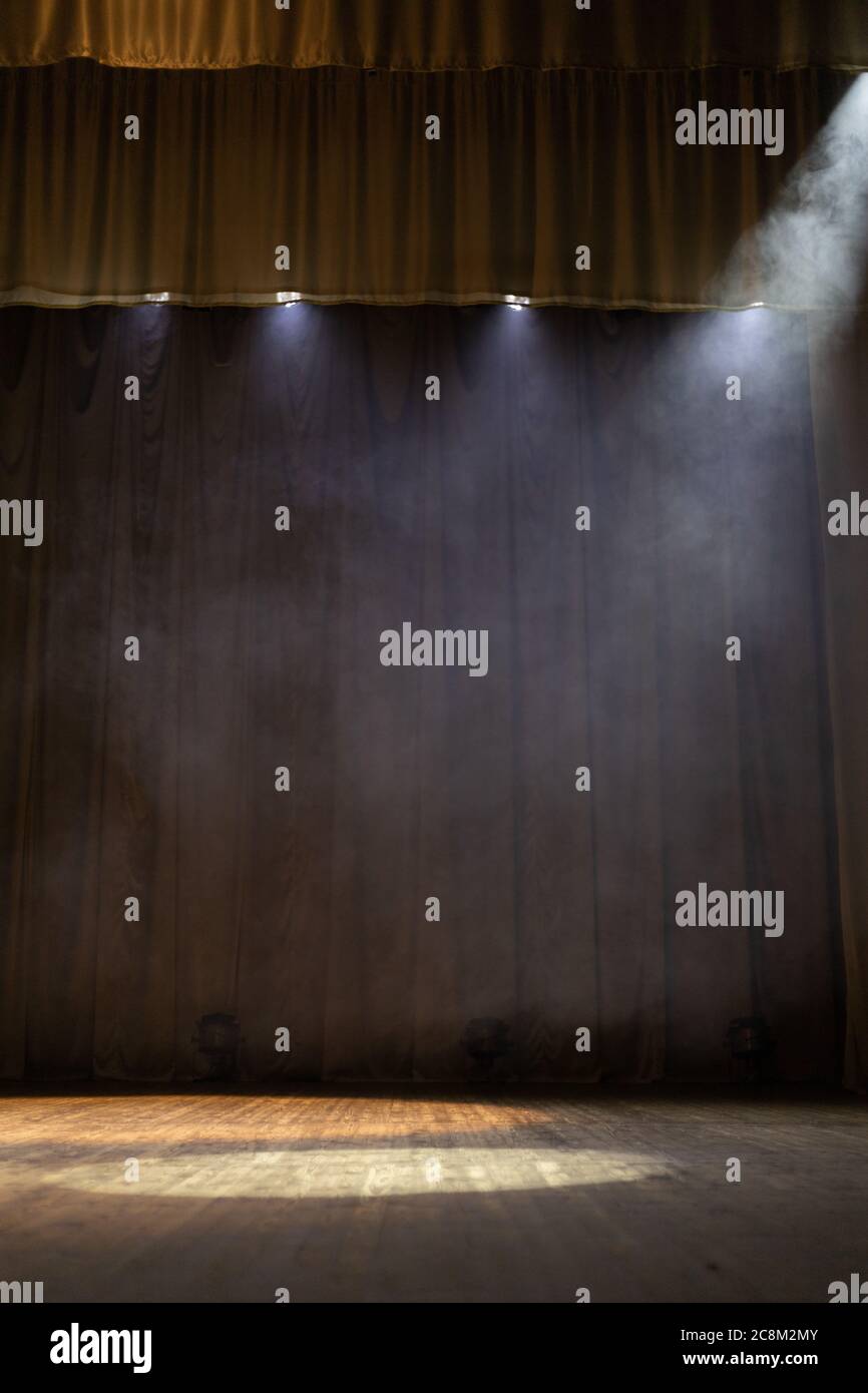 Theater stage, colored puffs of smoke in stage light Stock Photo - Alamy