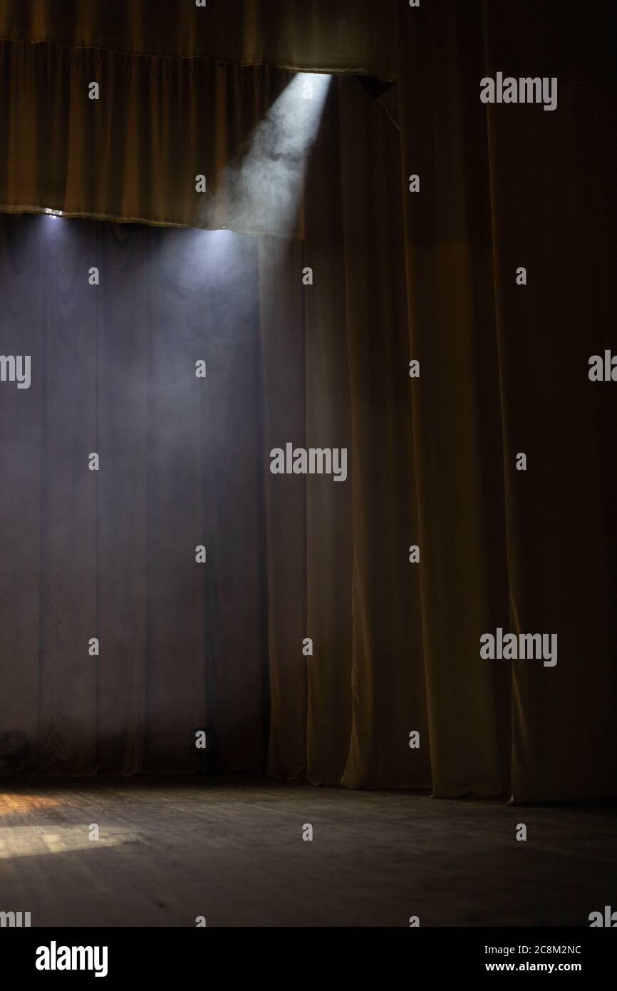 Theater stage, colored puffs of smoke in stage light Stock Photo - Alamy