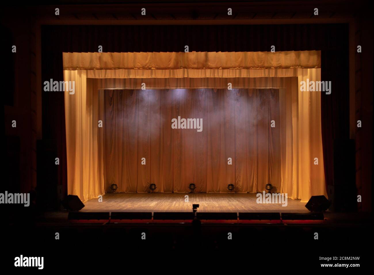 Theater stage, colored puffs of smoke in stage light Stock Photo - Alamy