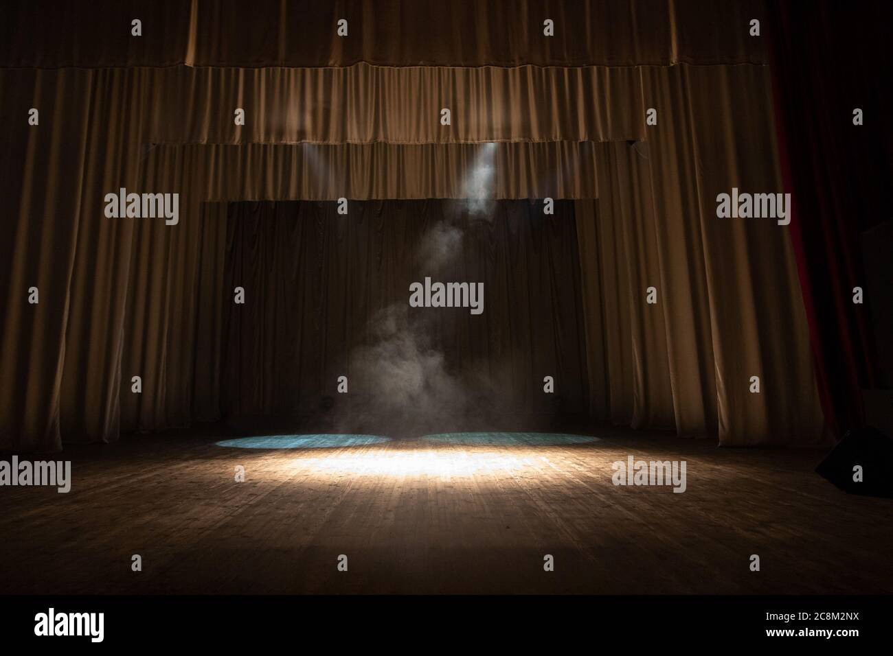 Theater stage, colored puffs of smoke in stage light Stock Photo - Alamy