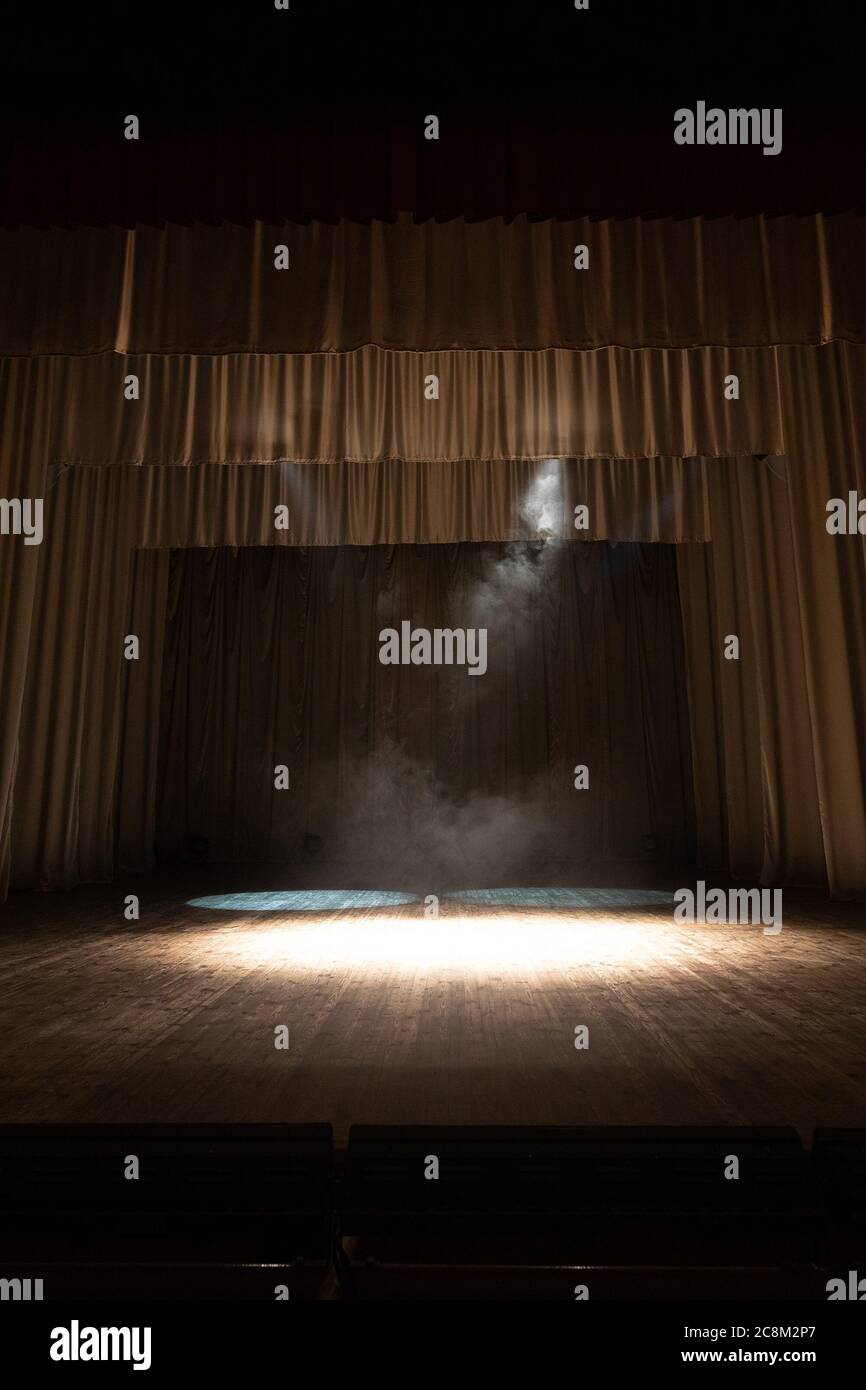Theater stage, colored puffs of smoke in stage light Stock Photo - Alamy