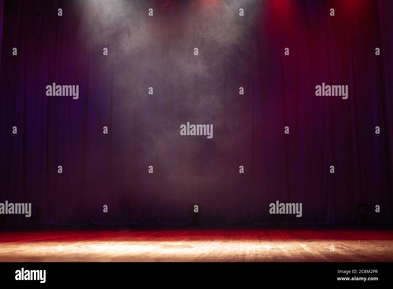 Theater stage, colored puffs of smoke in stage light Stock Photo - Alamy