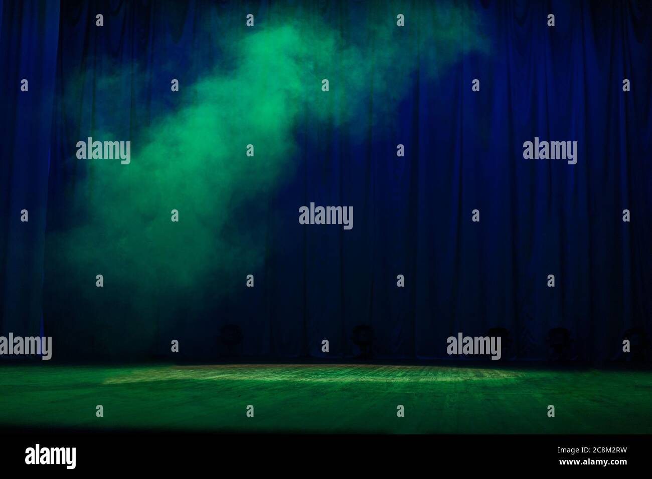 Theater stage, colored puffs of smoke in stage light Stock Photo - Alamy