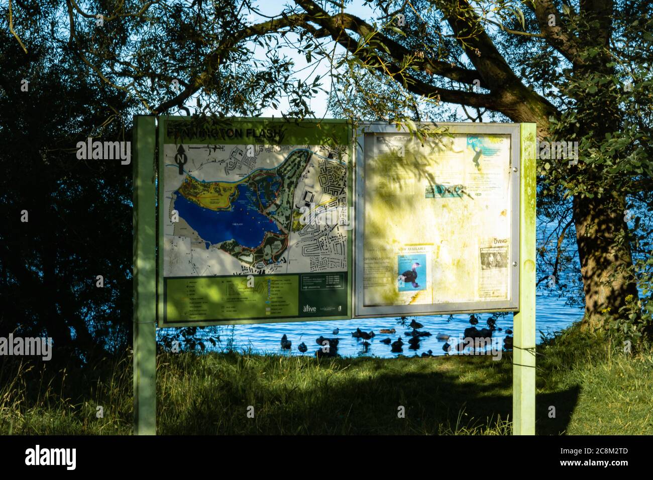 A sign of the surrounding area of Pennington Flash Country Park. A map ...