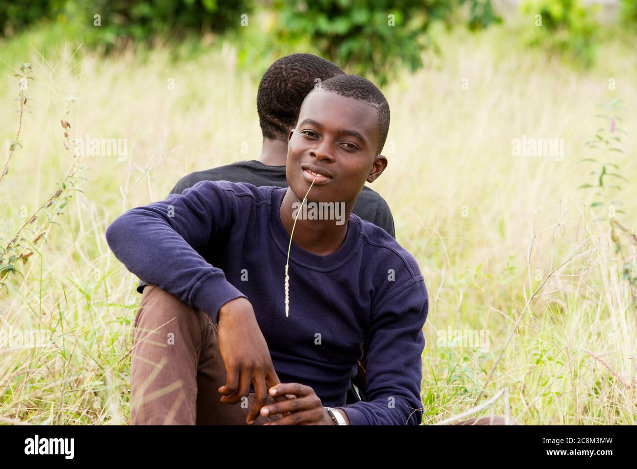 One leaning on the other hi-res stock photography and images - Alamy