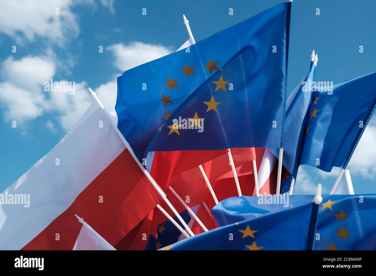 Polish and European Union flags on the blue sky background Stock Photo ...