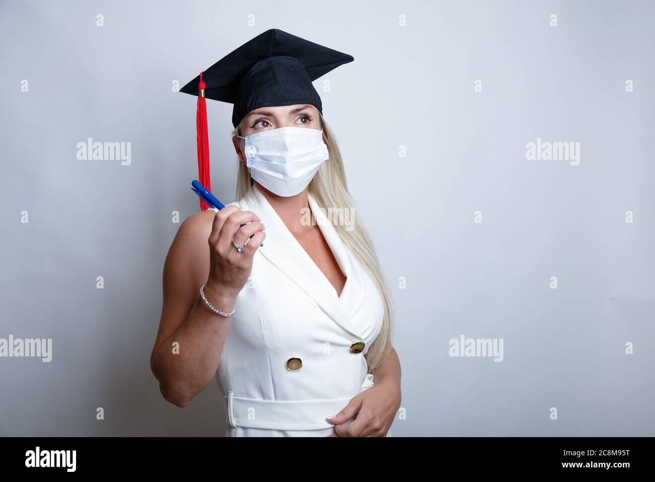 Graduation girl wearing cap protective hi-res stock photography and ...