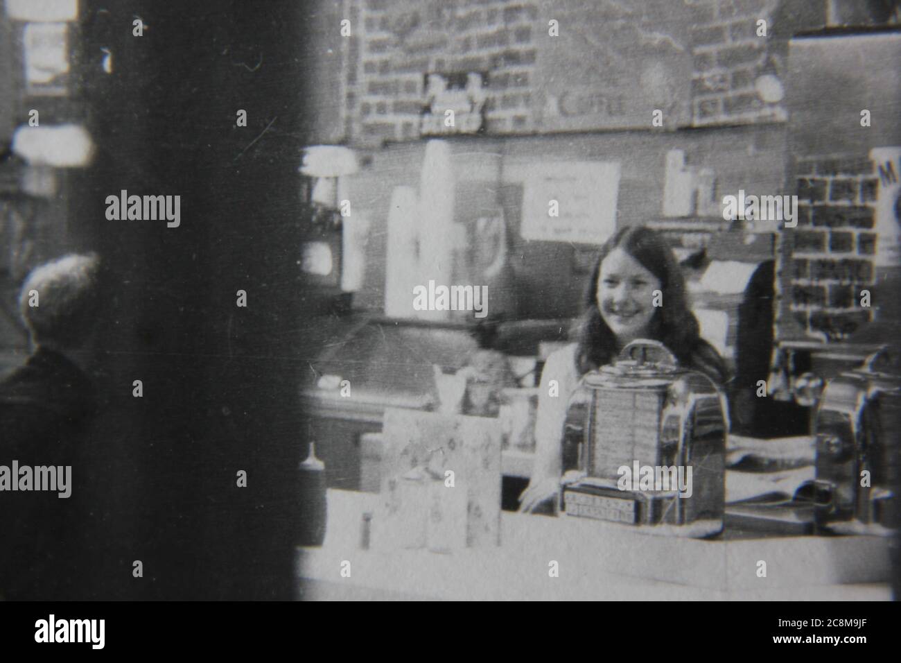 Young woman cashier 1970s hi-res stock photography and images - Alamy