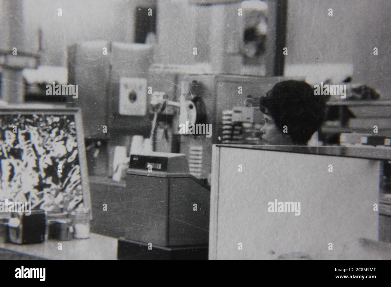 Fine 70s vintage black and white lifestyle photography of a cashier ...