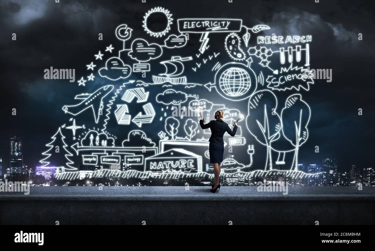 Woman throwing light on her ideas Stock Photo - Alamy