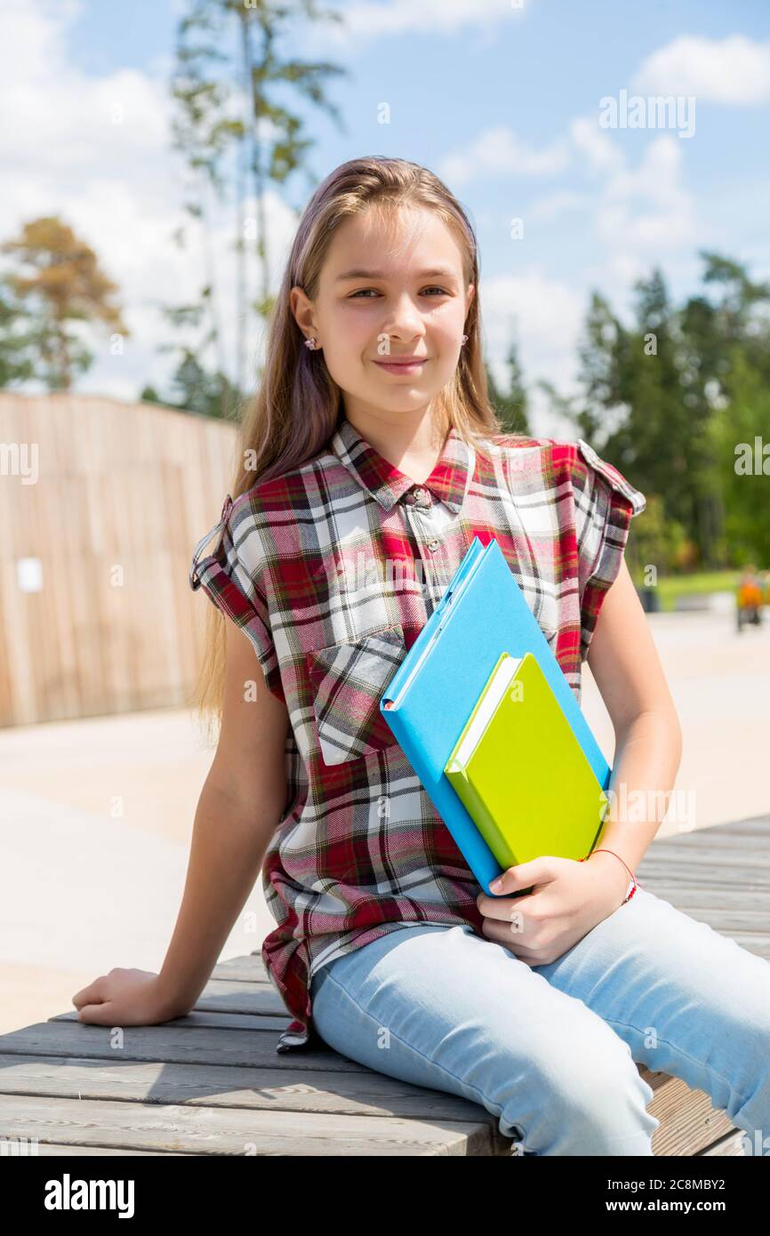 Girl Ready For School With Backpack and Books Stock Photo - Alamy