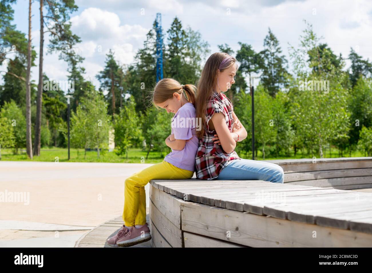 Cute school girls have conflict with each other Stock Photo - Alamy