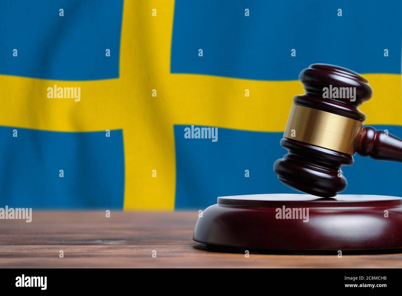 Justice and court concept in Kingdom of Sweden. Judge hammer on a flag ...