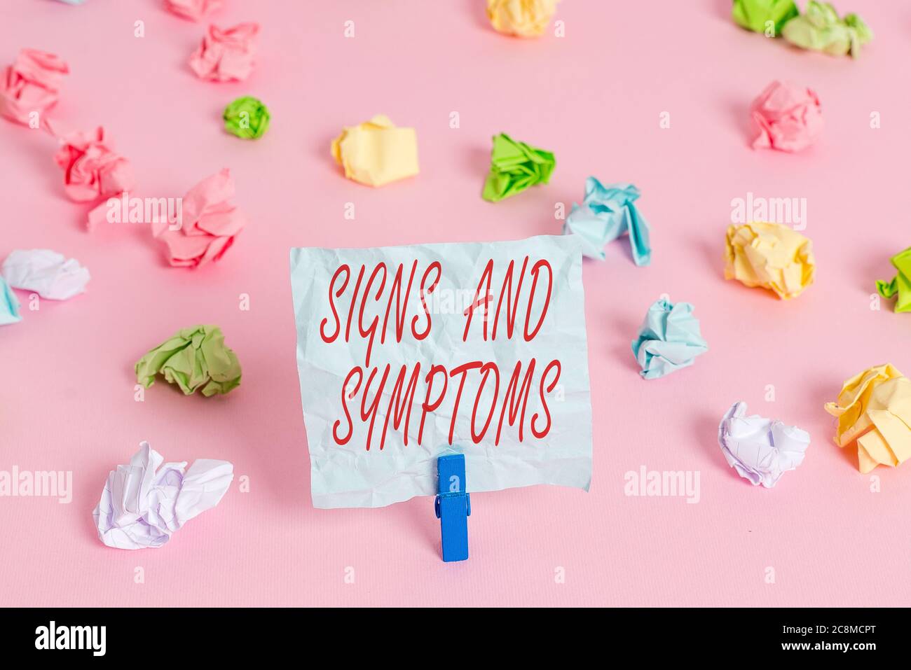 Writing note showing Signs And Symptoms. Business concept for ...