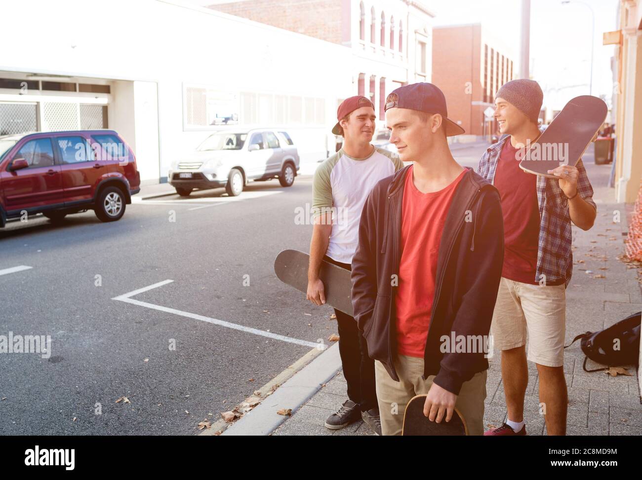 Three guys walking together in hi-res stock photography and images - Alamy