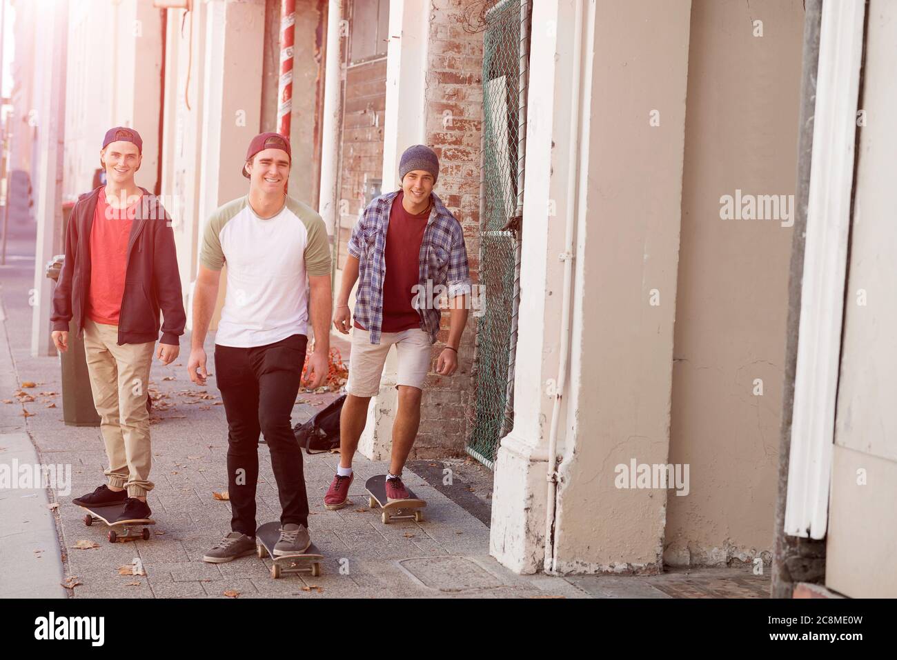 Three guys walking together in hi-res stock photography and images - Alamy