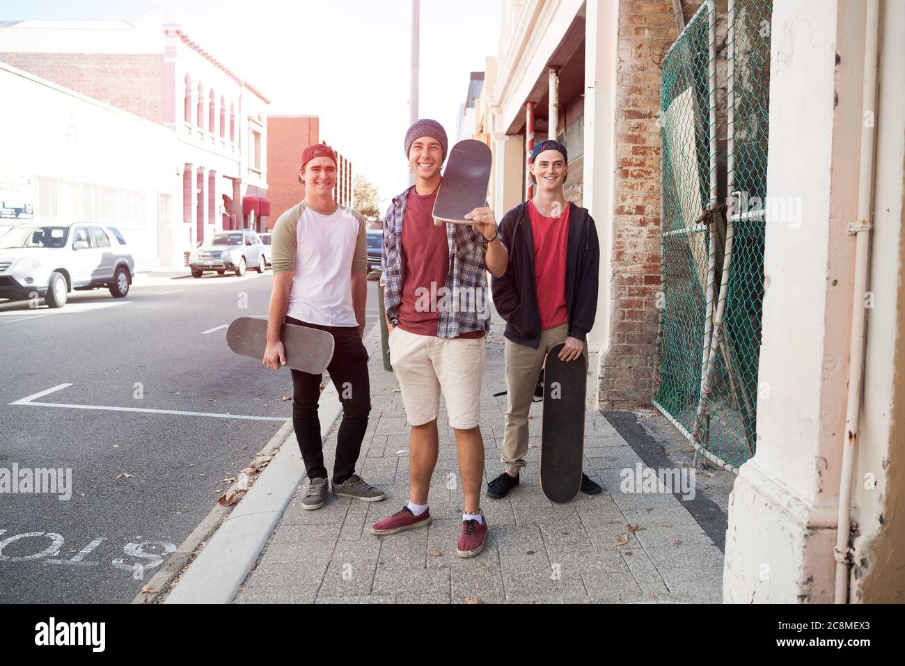 Three guys walking together in hi-res stock photography and images - Alamy
