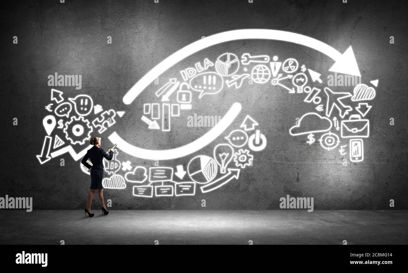 Woman throwing light on her ideas Stock Photo - Alamy